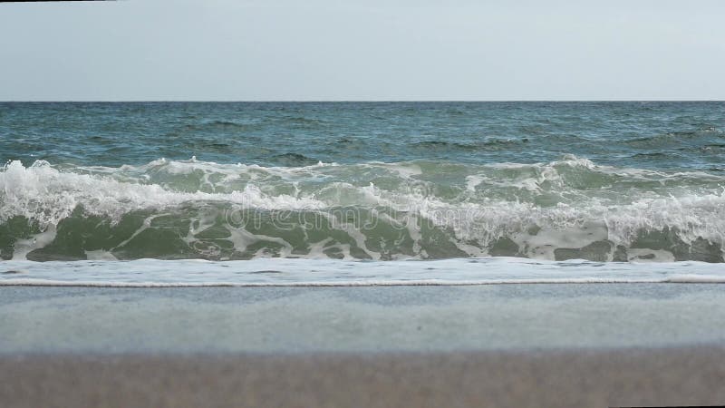 Ocean View: Waves Breaking on Sandy Beach with Horizon Perspective ...