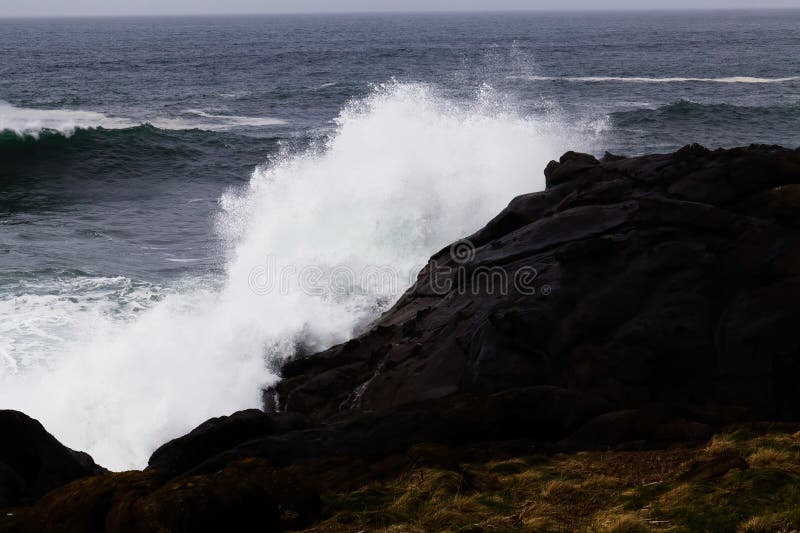 Ocean Wave Crashing into Volcanic Rock Shore Stock Photo - Image of ...