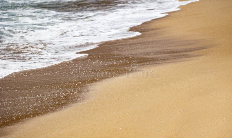 Ocean Wave Gently Washing Up on Smooth Golden Sand of a Quiet Beach in ...