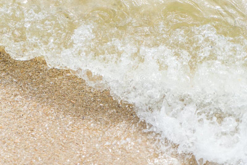 Ocean Wave Splashing on a Brown Beach Stock Image - Image of foam ...