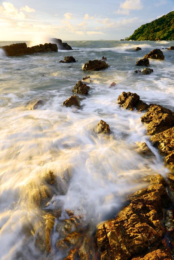 Ocean Waves Against Rocks on the Beach Stock Photo - Image of rocks ...