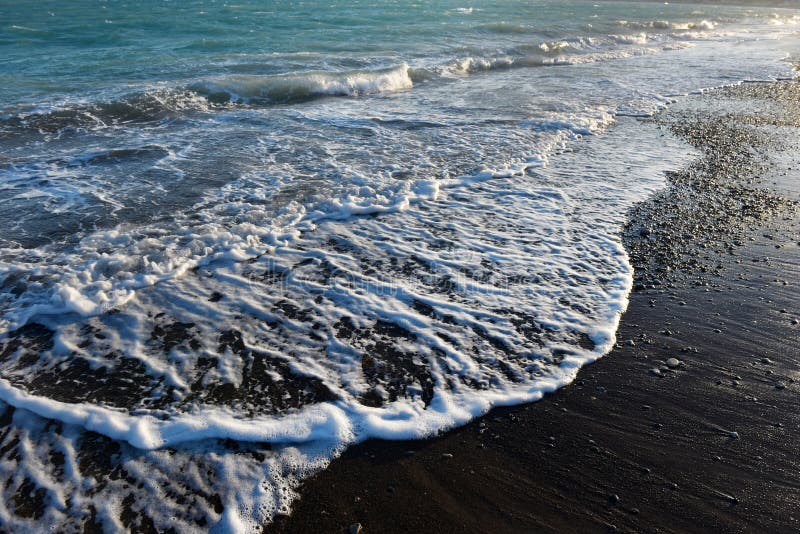Ocean waves on sandy beach stock photo. Image of ocean - 112556708