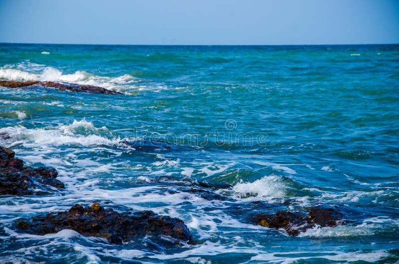 Ocean Waves Breaking on the Rocks on the Shore. Stock Photo - Image of ...