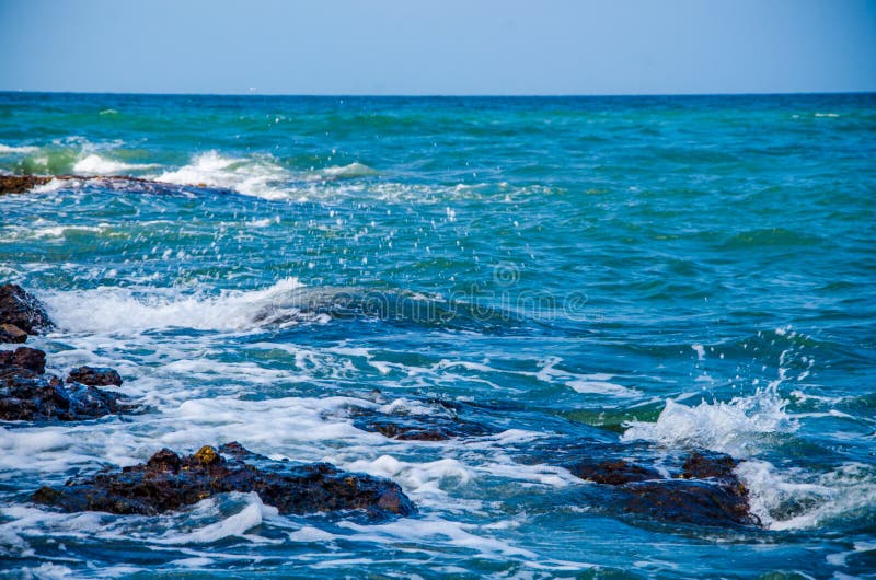 Ocean Waves Breaking on the Rocks on the Shore. Stock Photo - Image of ...