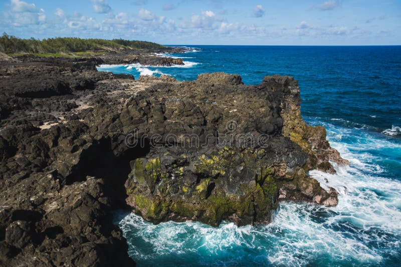 Ocean Waves Crashing Onto the Rocks in the Sunset. Stock Image - Image ...