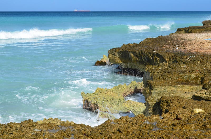 Ocean Waves Crashing on Sharp Jagged Rock Along the Coast Stock Photo ...