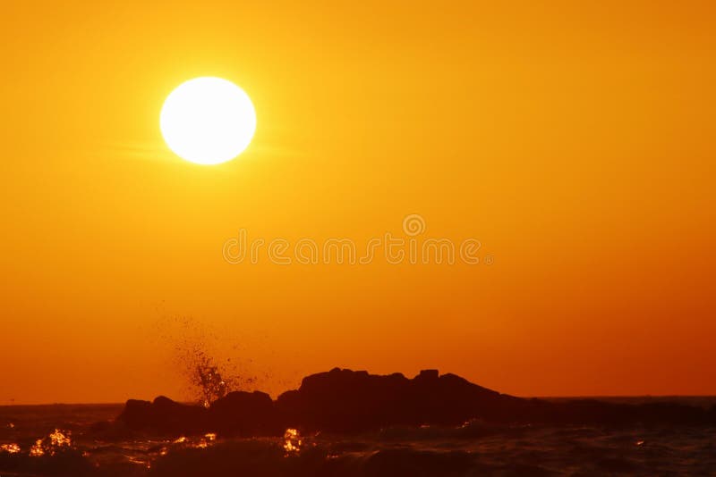 Ocean Waves Fighting with Rocks and Orange Sky with Sunset Stock Image ...