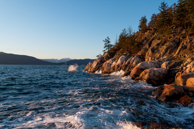 Ocean Waves Hitting Rocks on Coast while Sunset Stock Photo - Image of ...