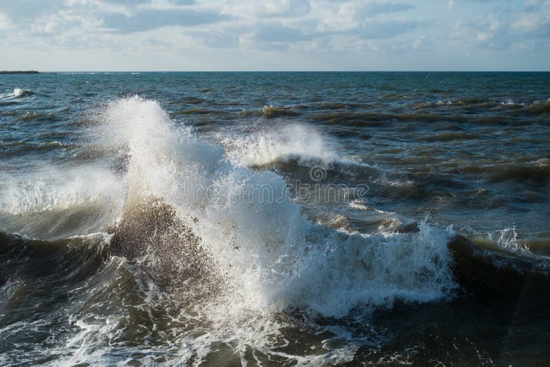 Ocean waves hitting rocks stock photo. Image of nature - 135673664