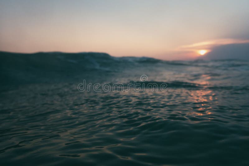 Ocean Waves and Ripples at Sunset with Pink and Orange Sky Stock Photo ...