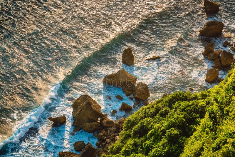 Ocean with Waves and Rocks with Sunset in Bali Stock Photo - Image of ...