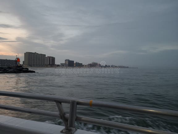 Oceanfront Beach Sunset stock image. Image of pier, water - 212629467