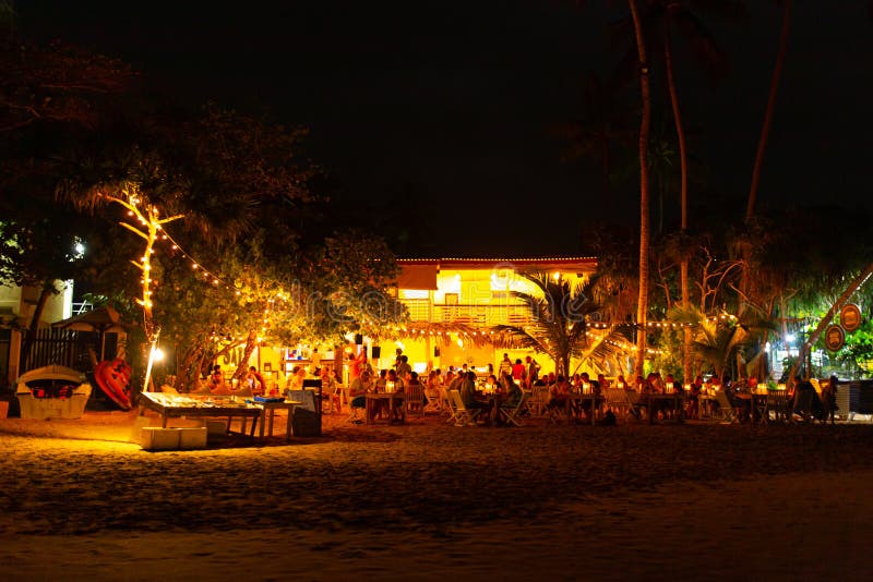 Oceanfront Restaurant with Lights and Tables on a Sandy Beach Stock ...