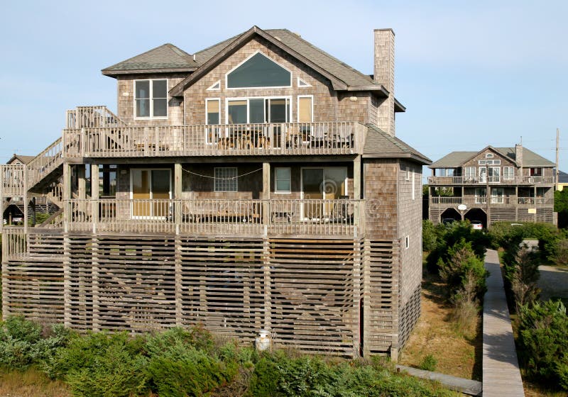 Oceanside Vacation Rental Houses Stock Image - Image of wooden, sand ...