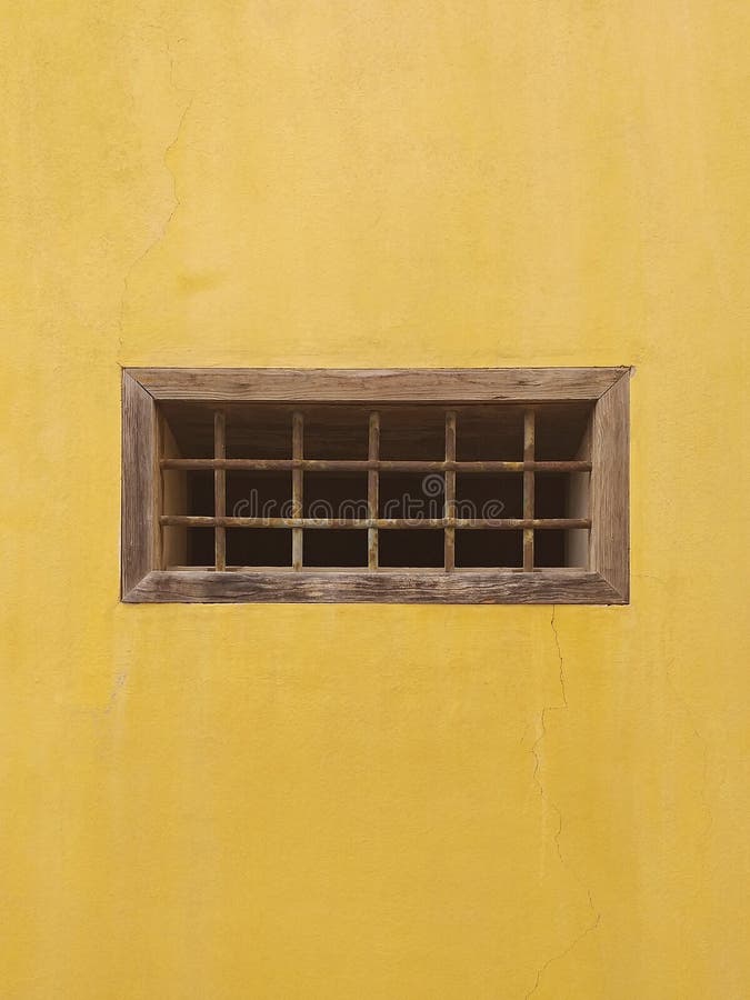 Ocher Wall with Old Small Rectangular Window with Iron Bars. Old Window ...