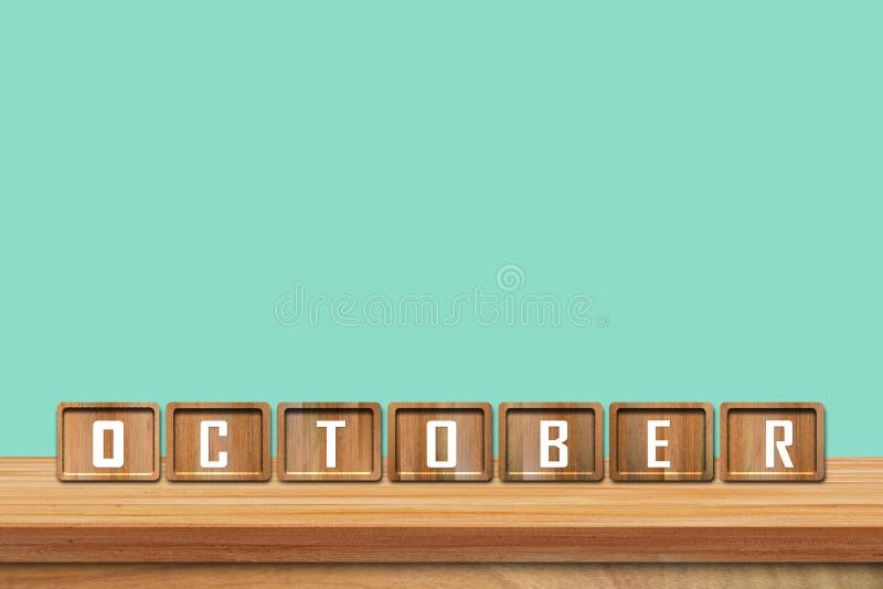 October Alphabet Blocks on Wooden Table with Blue Background Stock ...