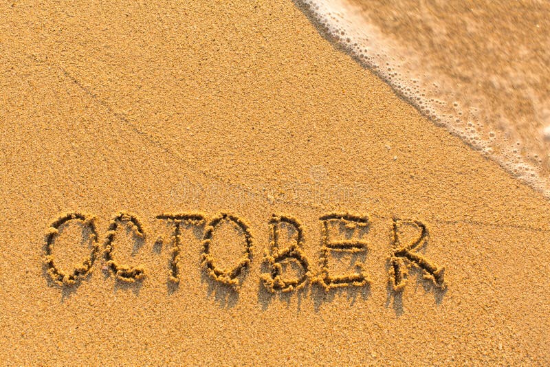 October - Inscription on Sand Beach with the Soft Wave. Calendar. Stock ...