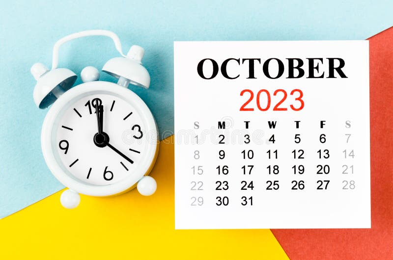 The October 2023 Monthly Calendar Year with Alarm Clock on Colourful ...