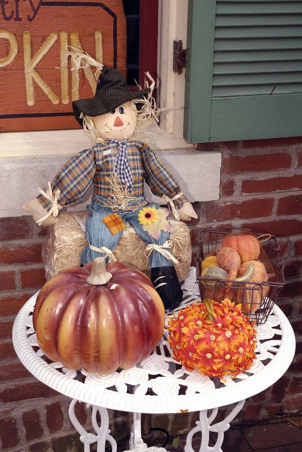 October Seasonal Harvest Display on a Wrought Iron Table Near a ...