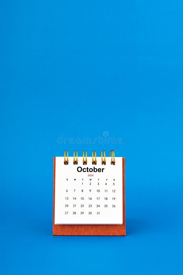 October 2024 White Desk Calendar on Blue Background Stock Photo - Image ...