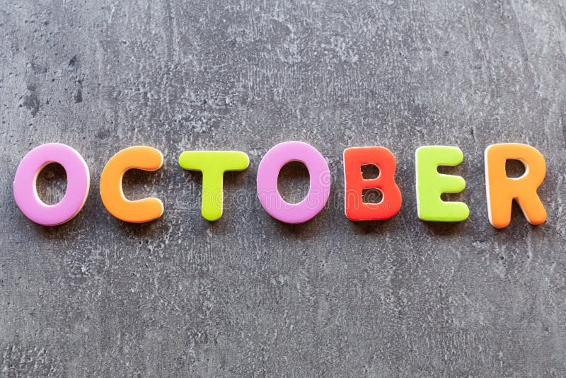 October Word Written with Colorful Letters on Grey Granite Stone ...