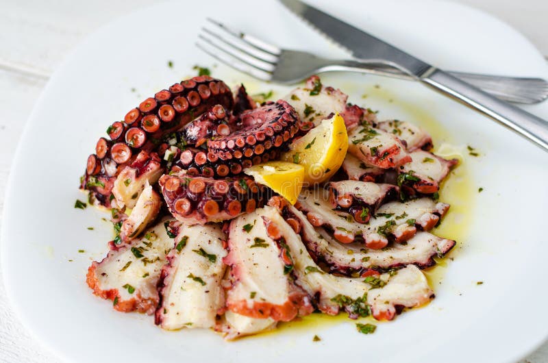Seafood Appetizer. Octopus Carpaccio on White Plate. Mediterranean ...