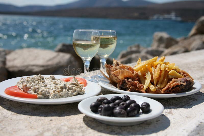 Octopus, Chips, Olives by the Sea Stock Photo - Image of delicious ...