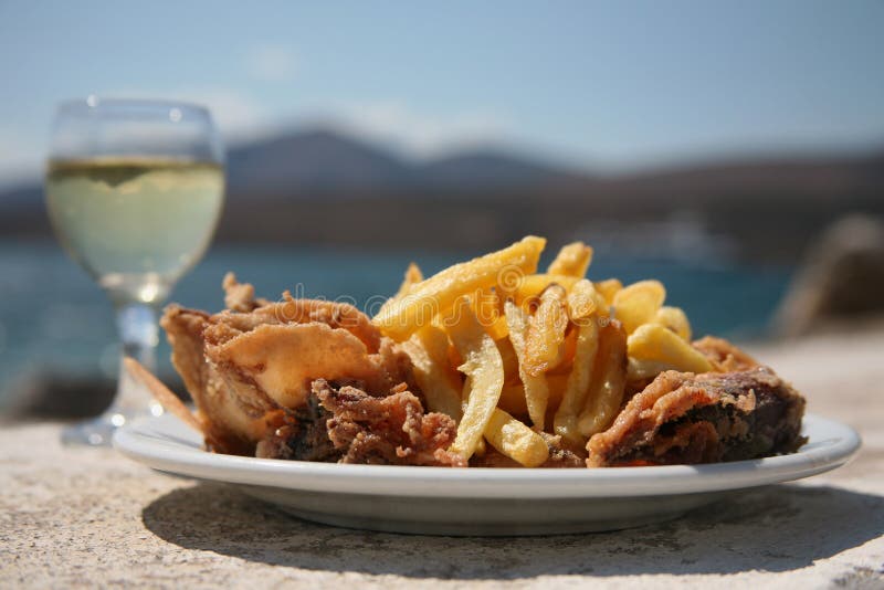 Octopus and chips stock photo. Image of fries, glass - 61555638
