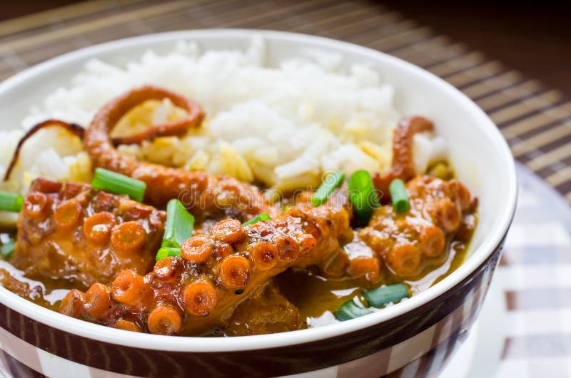 Octopus With Rice Served With Paprika Stock Photo - Image of grilled ...