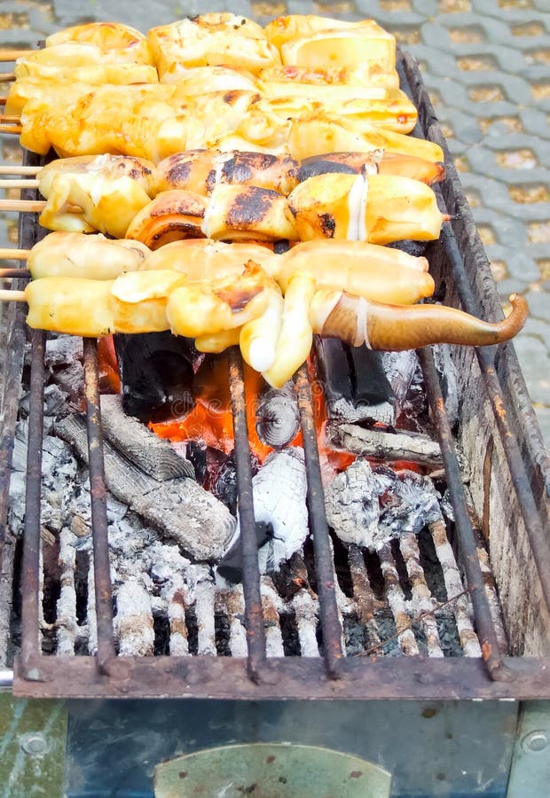 Octopus Grill with Onion, Garlic, Capper. Baked Seafood Cocktail with ...