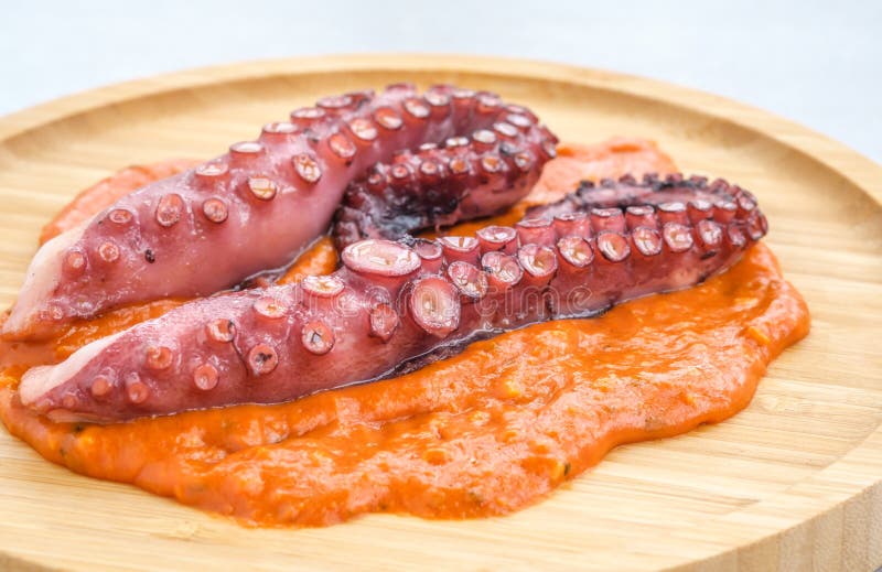 Octopus with romesco sauce stock photo. Image of orange - 248335126