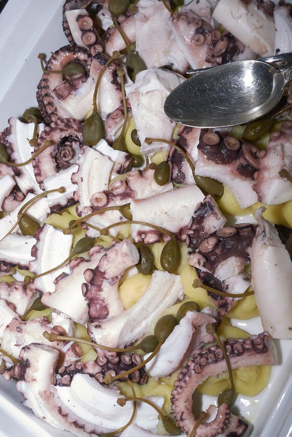 Octopus salad and capers stock photo. Image of food - 135529858