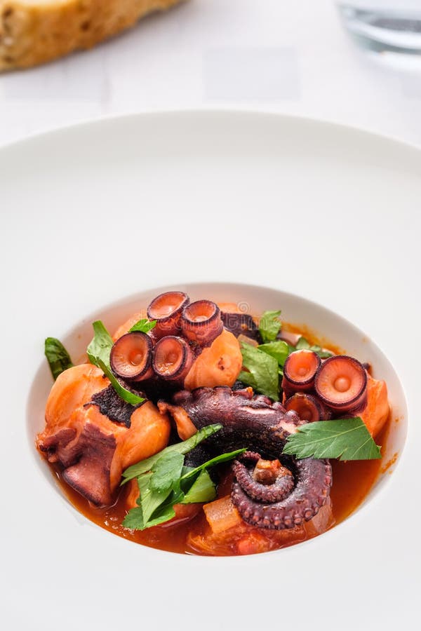 Octopus Stewed with Tomatoes and Parsley Stock Photo - Image of meal ...