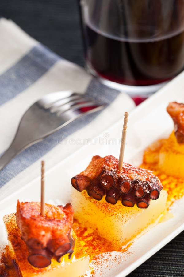 Octopus tapa with wine stock photo. Image of appetizer - 24519568