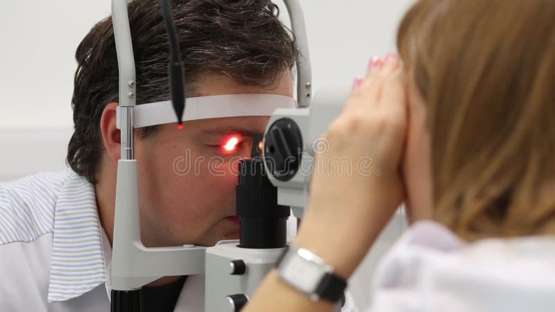 Oculist is Inspecting Eyes of Man by the Slit Stock Video - Video of ...