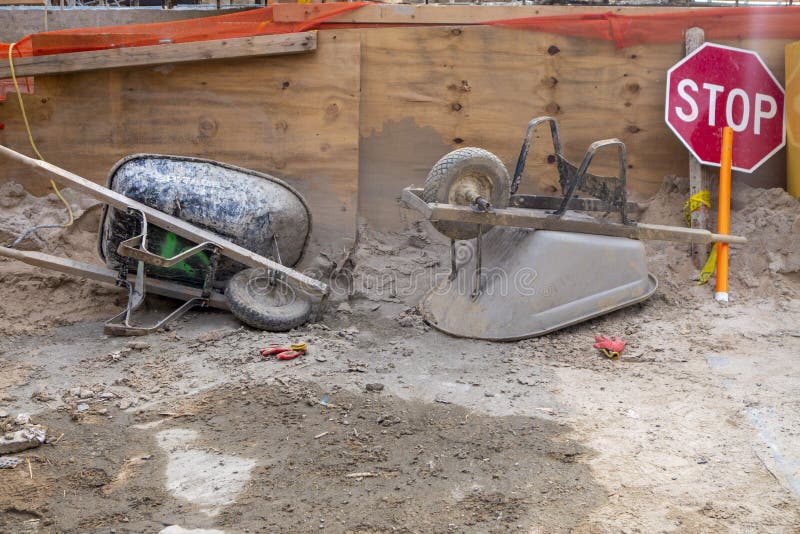 Off from Construction Work. Stop Sign Post and Two Wheel Barrels Laying ...
