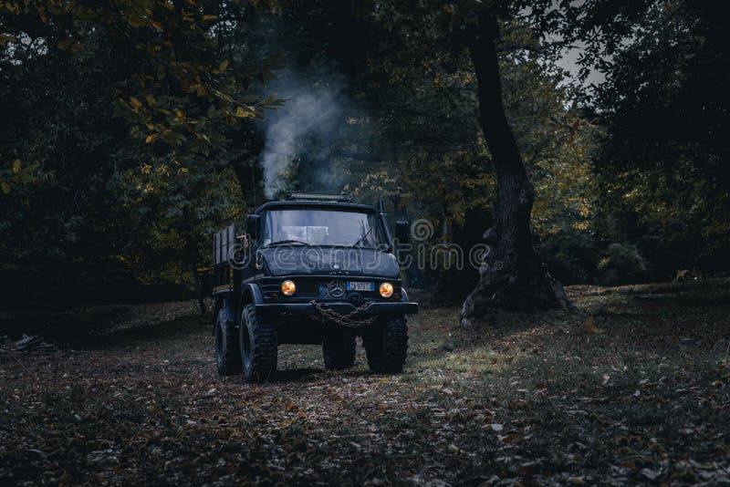 Off-road Black Car Driving in the Dark Forest Editorial Stock Image ...