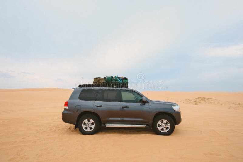 Off-road car in a desert stock photo. Image of safari - 201938862