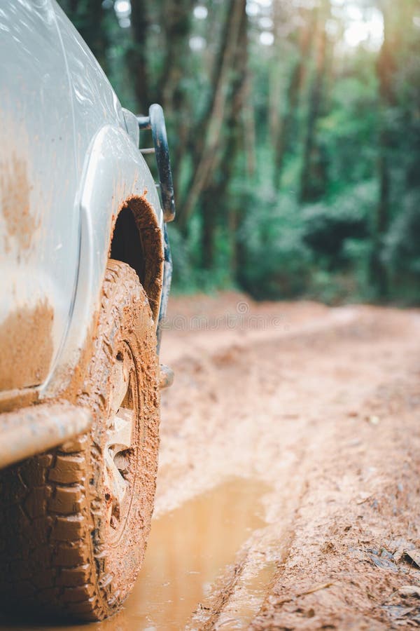 Off Road Cars on Muddy Road. Low Angle View of Front of SUV on Mountain ...