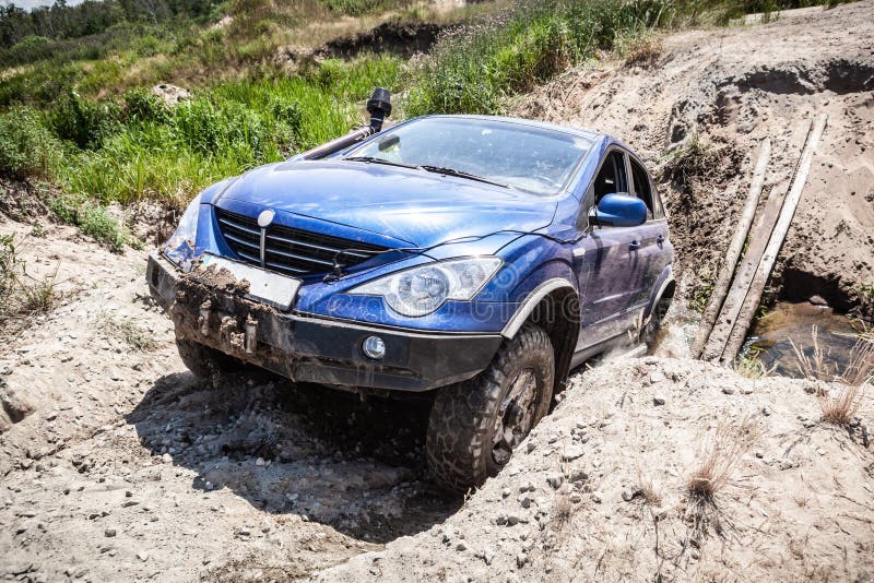 Off Road Racing Car Drive Along the Dusty Road Stock Photo - Image of ...
