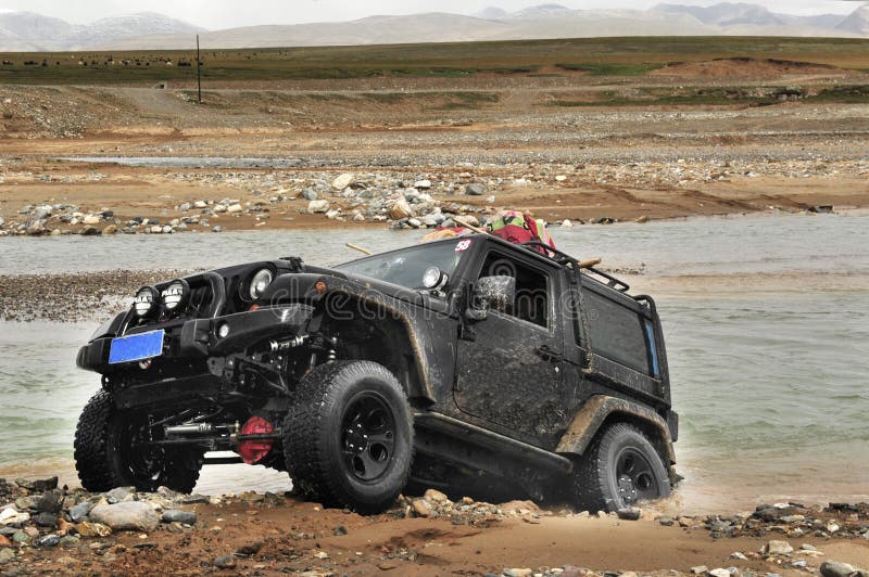 An Off-road Vehicle Cross River Stock Photo - Image of county ...