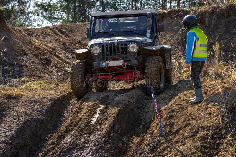 Off-road Vehicle in Difficult Sandy Terrain, Co-driver Helps the Driver ...