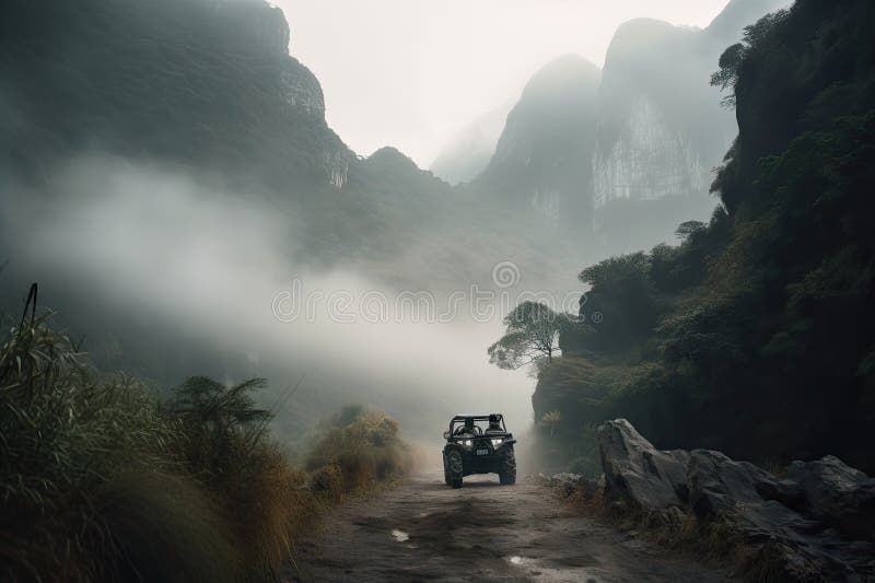 Off-road Vehicle Entering a Misty Valley with Towering Cliffs Stock ...