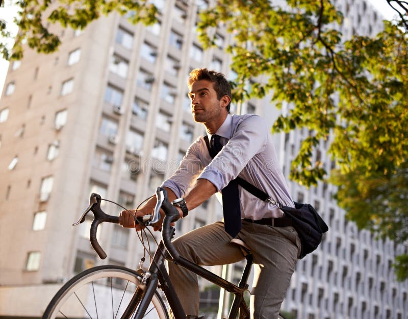 Off To Work on His Wheels. Shot of a Businessman Commuting To Work with ...
