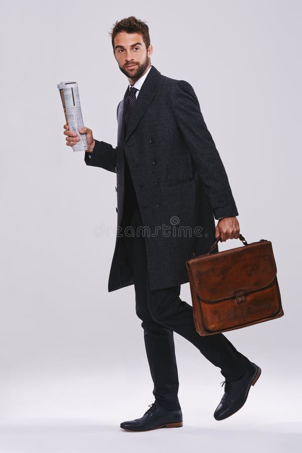 Off To Work. Studio Shot of a Handsome and Well-dressed Young Man ...