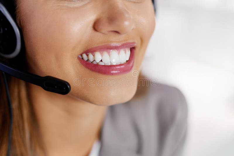 Offering Customer Support with a Big Smile. Closeup Shot of an ...