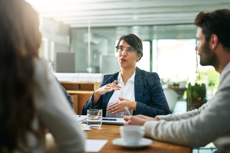 Offering a Different Perspective. a Group of Businesspeople Meeting in ...