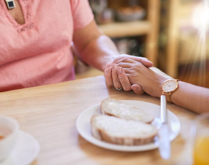 Offering a Hand of Support. a Nurse Holding a Senior Womans Hands in ...