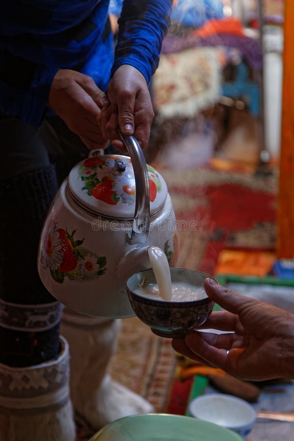 Offering tea in the yurt stock photo. Image of asia - 176148266
