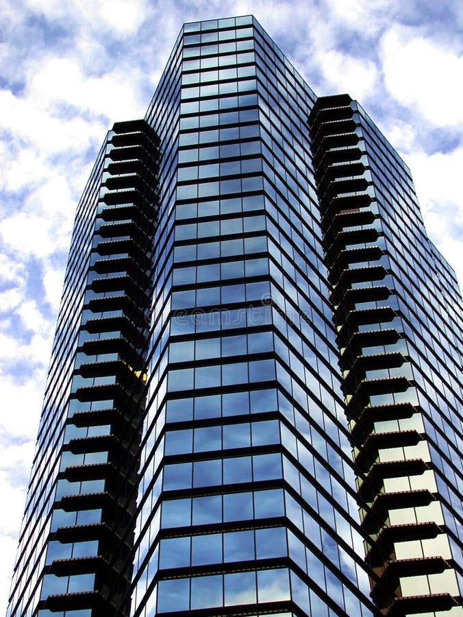 Office Building in Clouds stock image. Image of building - 206771